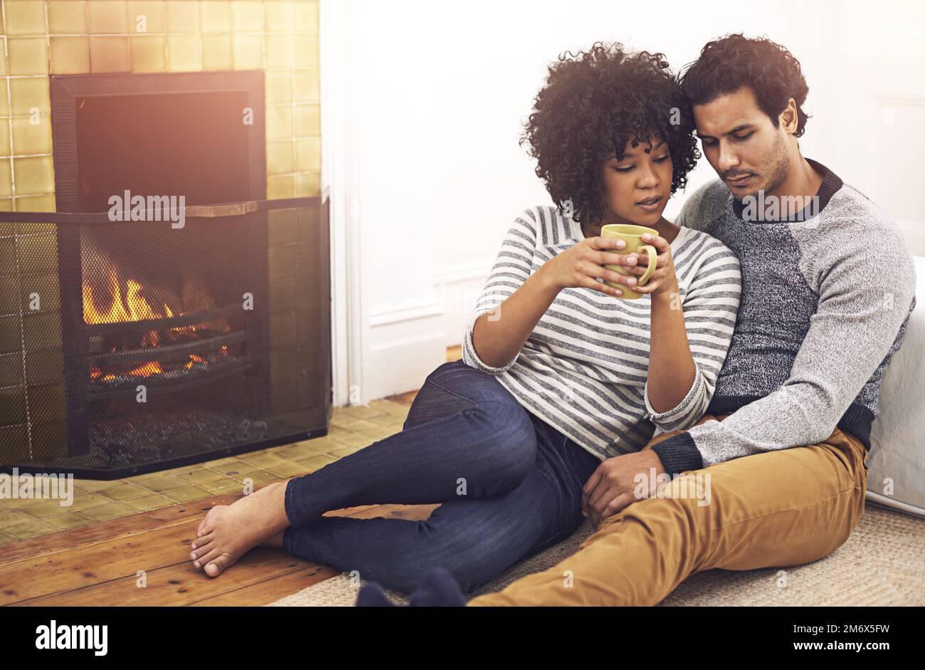 Coffee and cuddles... the perfect combo. an affectionate couple ...