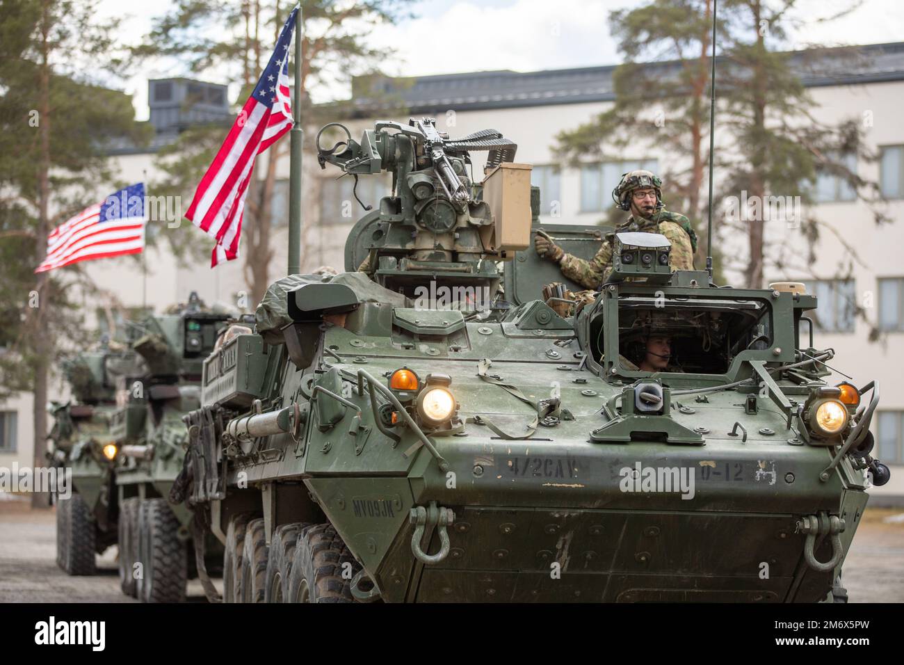 U.S. Army Staff Sgt. Eric Chartier climbs onto a Stryker driven by Pfc ...