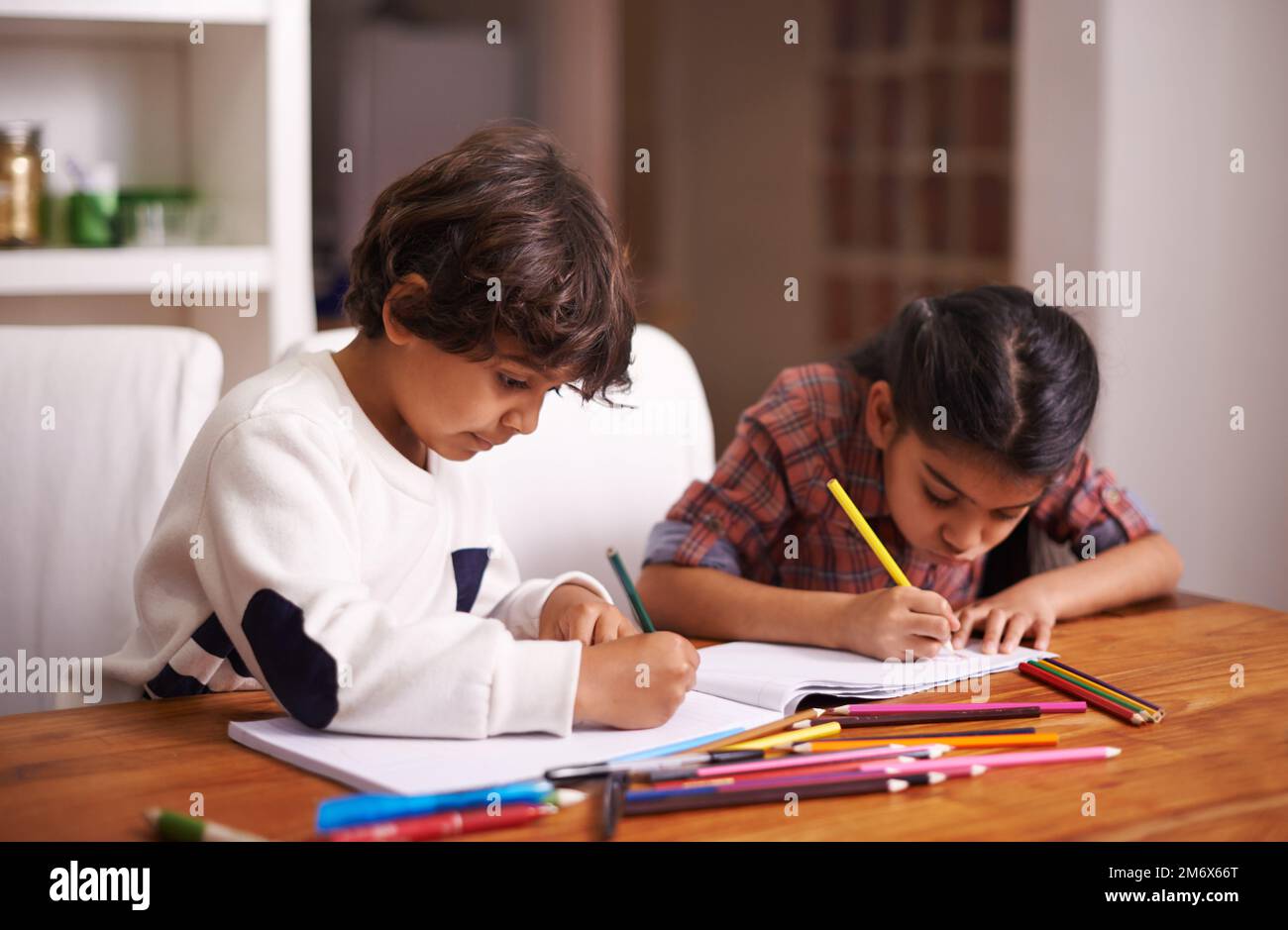 Drawing some pictures that we can give to mom. two siblings drawing ...