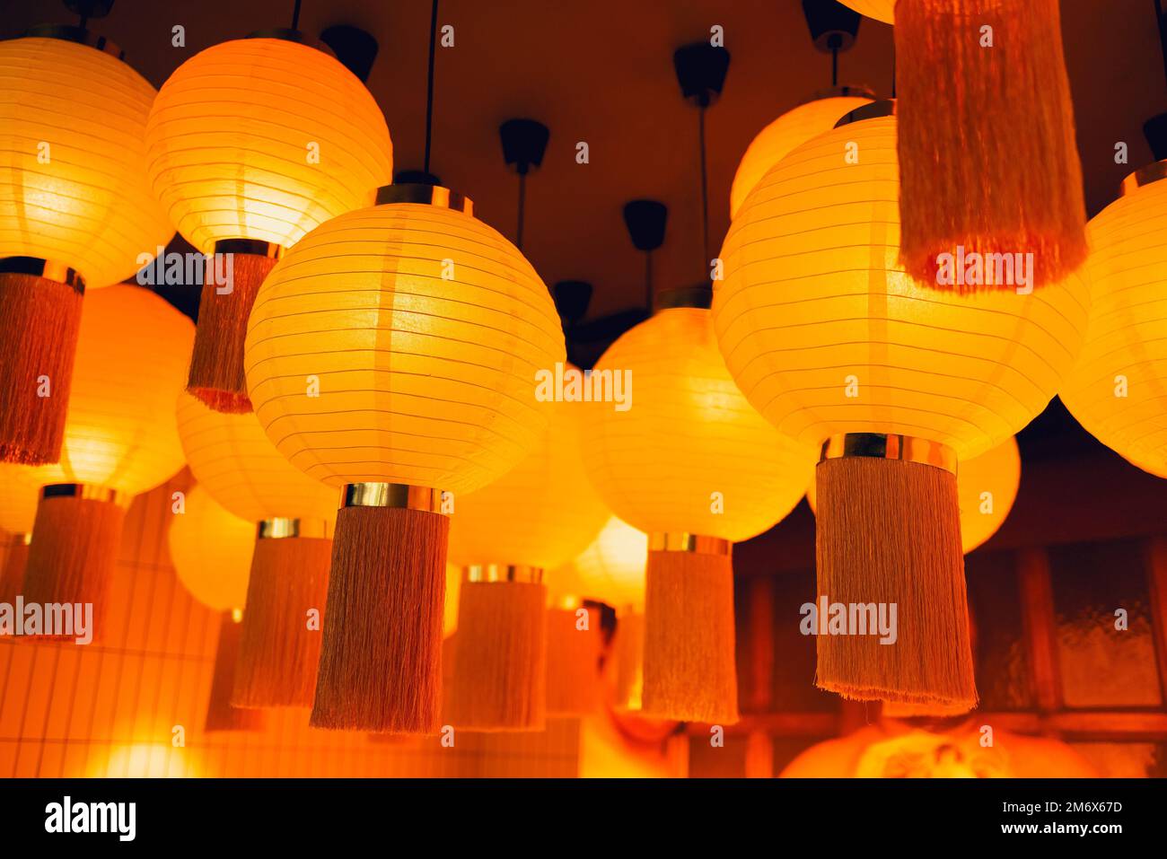 Illuminated hanging rows of japanese paper lanterns hi-res stock ...