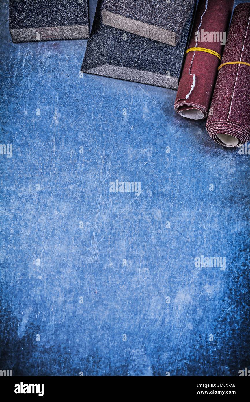 Abrasive sponges sandpaper on scratched metallic background ...