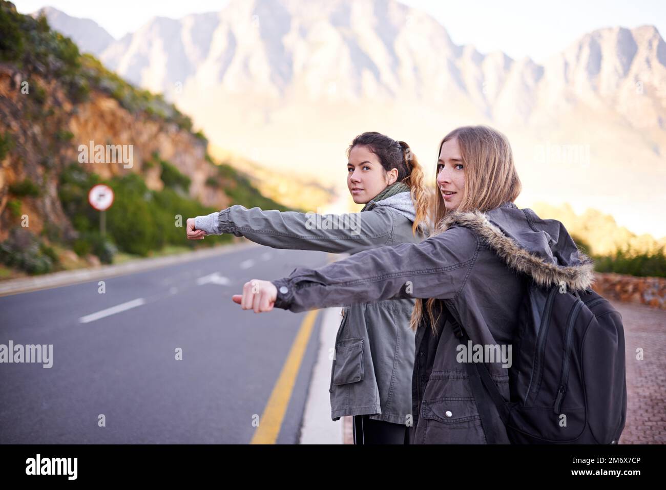 Two women hitchhiking together hi-res stock photography and images - Alamy