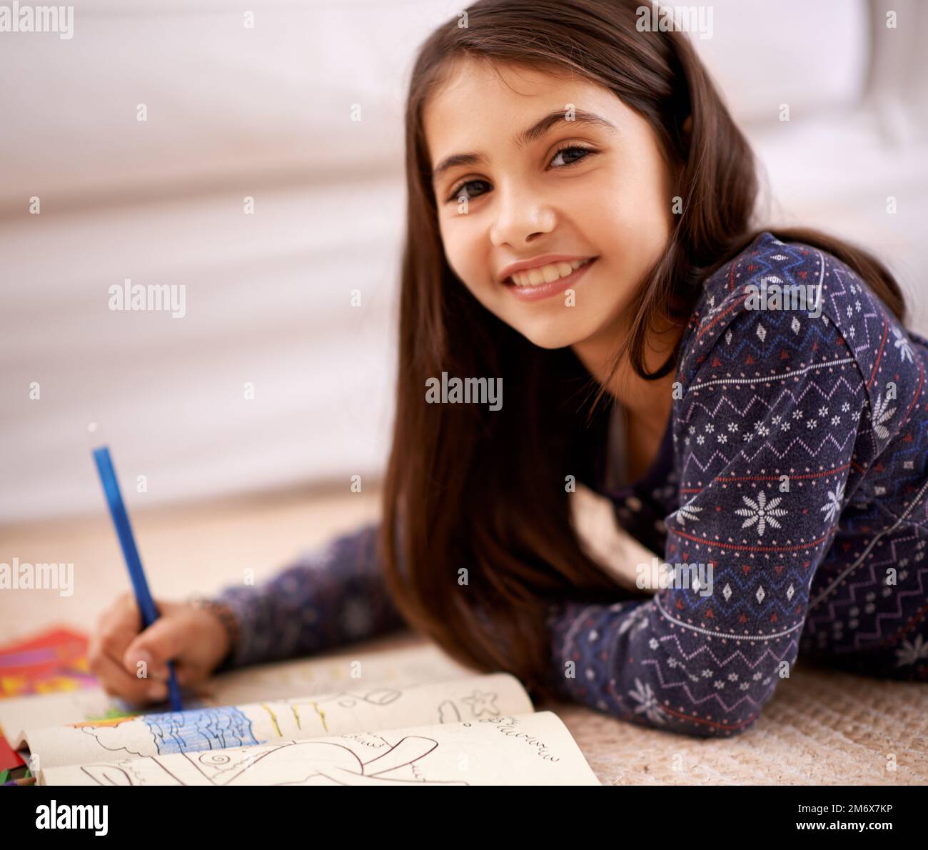 Be bold and color outside the lines. Portrait of a young girl coloring ...