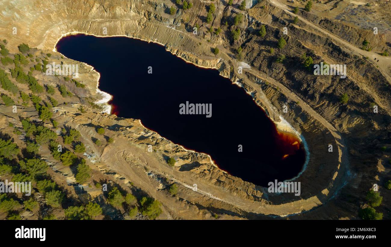 Drone aerial of copper mine with red toxic water. Environmental ...