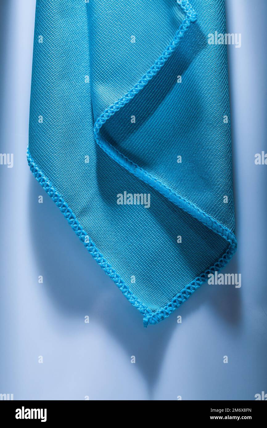Blue cleaning cloth on white surface Stock Photo - Alamy
