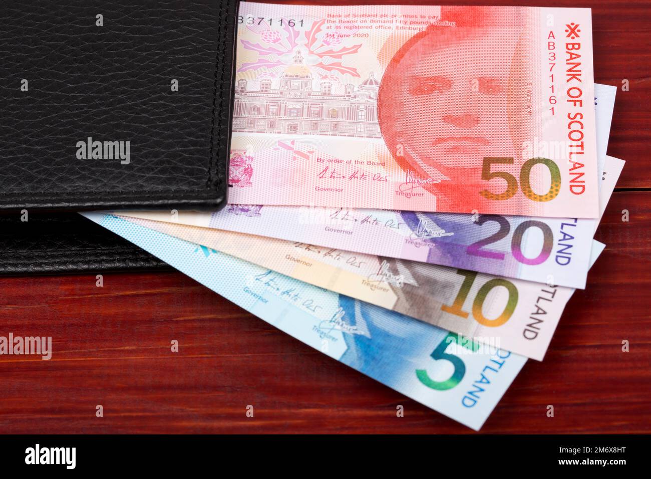 Wallet pound notes hi-res stock photography and images - Alamy