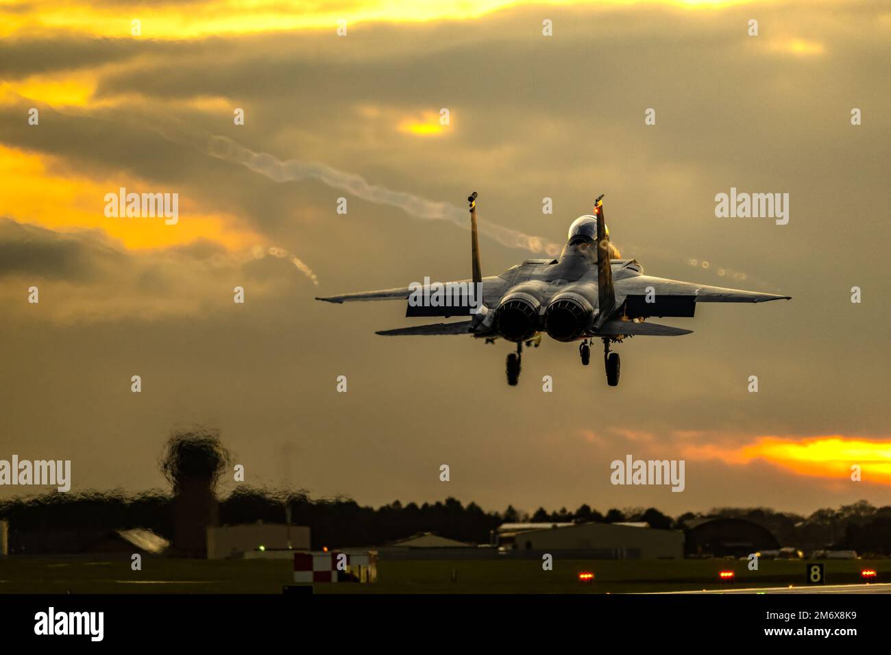 An army fighter jet departing from the airport on the background of the ...