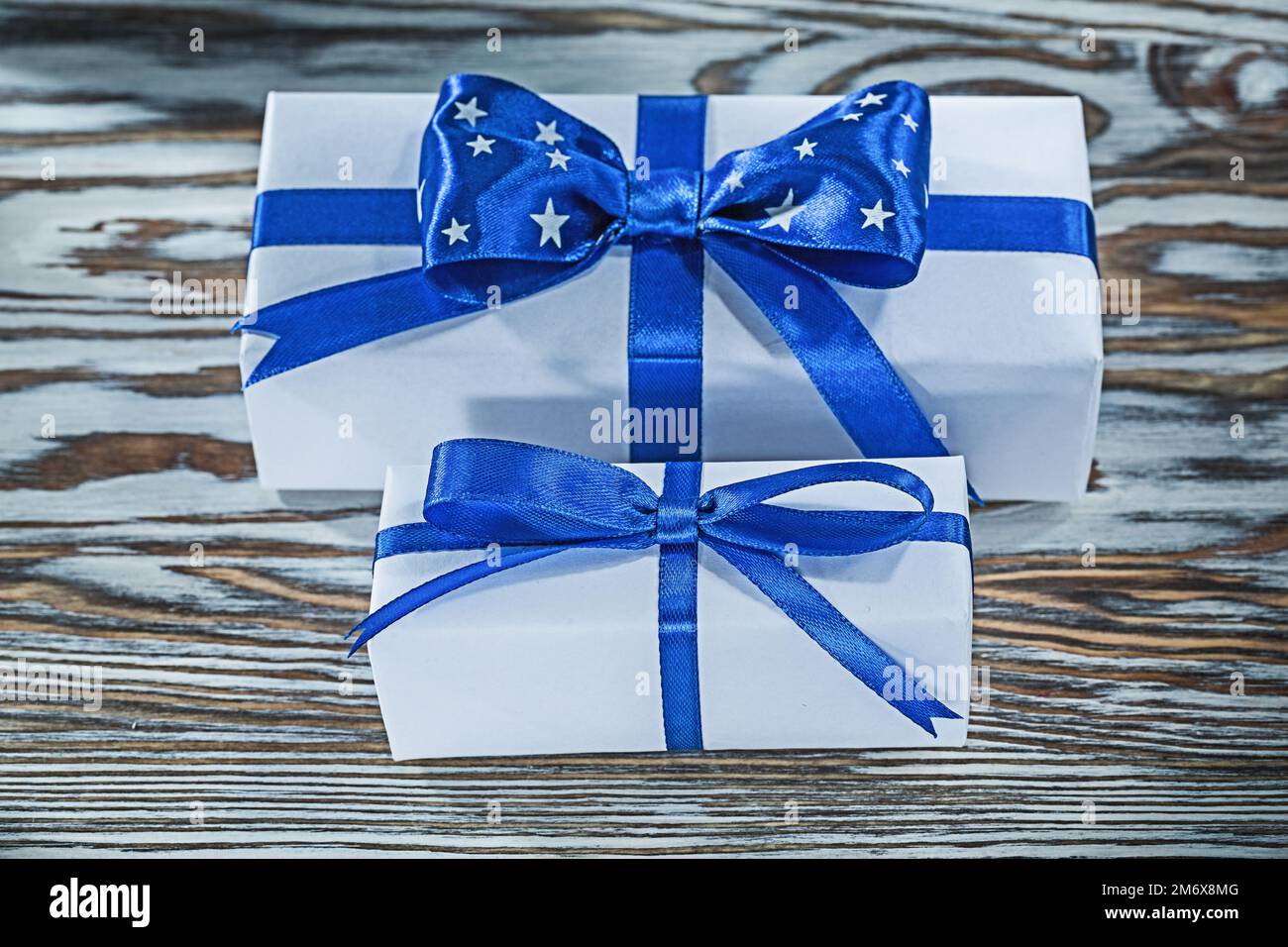 White boxes with blue ribbons hi-res stock photography and images - Alamy