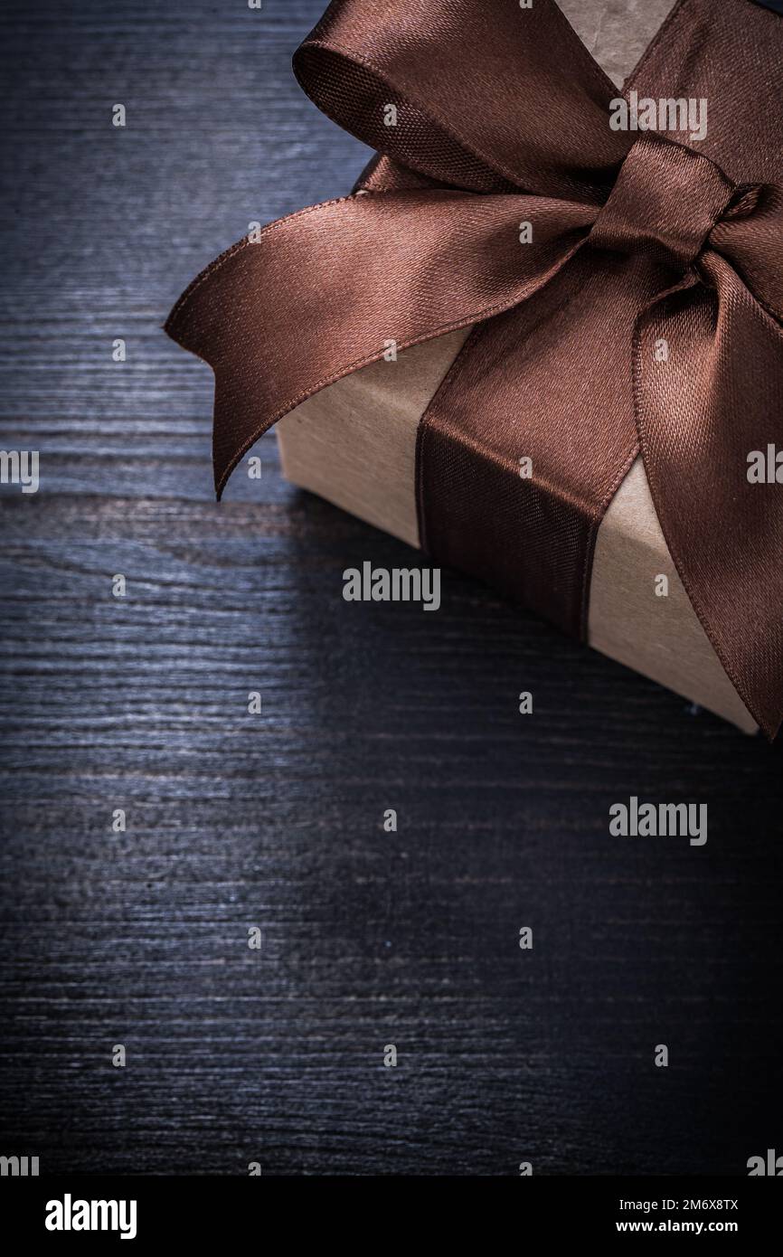 Boxed present in wrapping paper on vintage wood board copyspace Stock ...