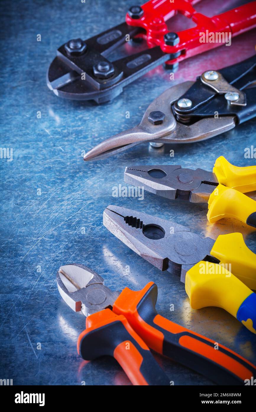 Bolt cutter tin snips gripping tongs nippers on scratched vintage ...