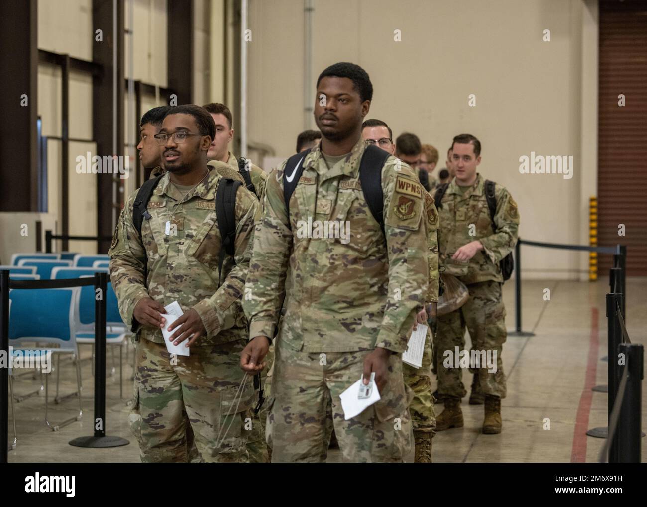 U.S. Airmen assigned to the 35th Fighter Wing pass through a personnel ...
