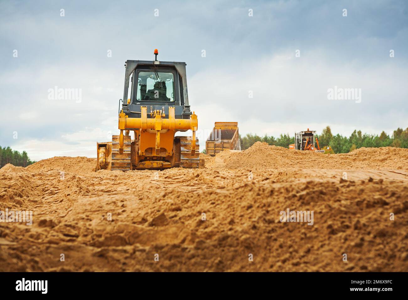 Bulldozer on sand Stock Photo - Alamy