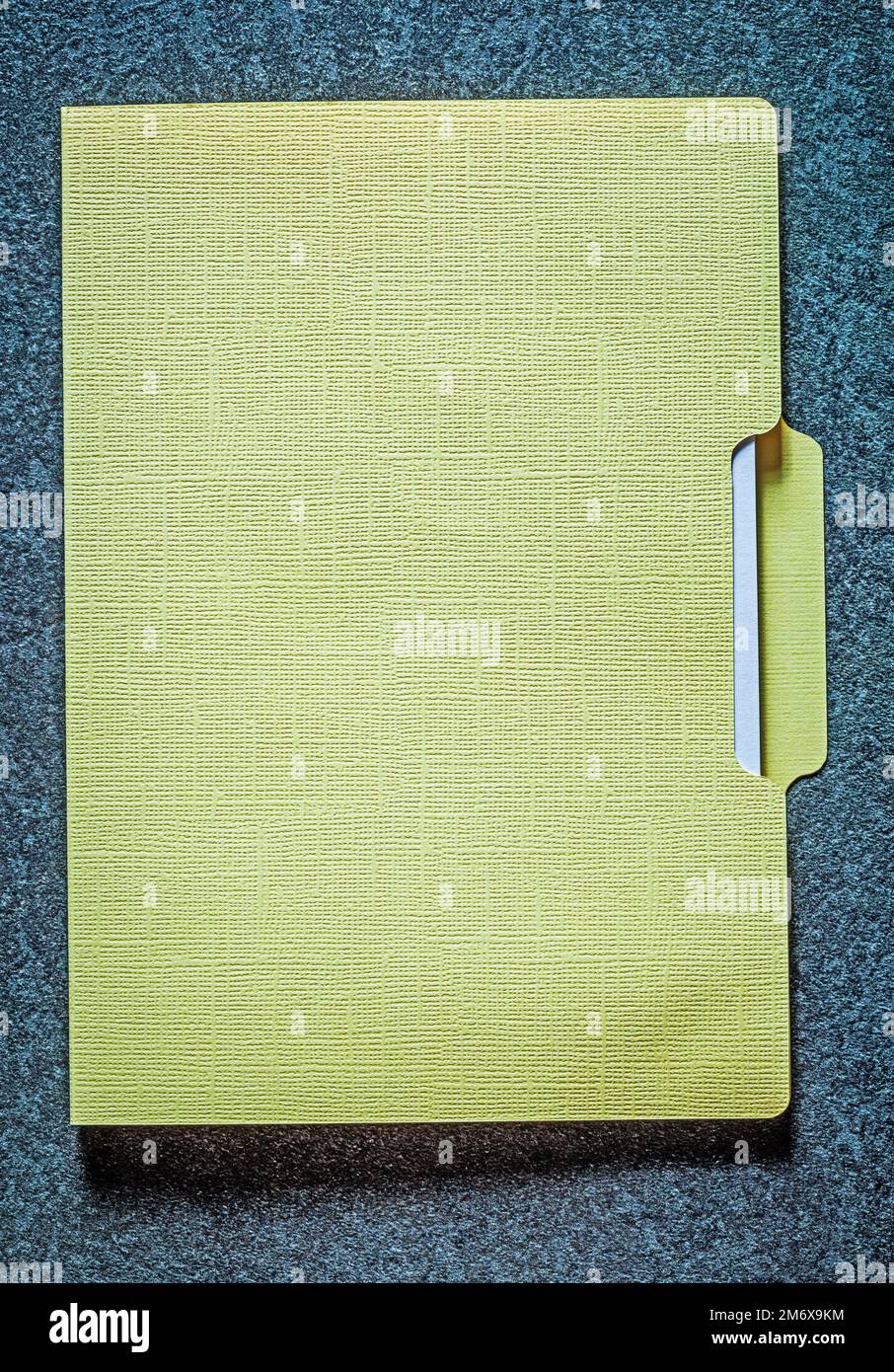 Cardboard office folder on black background Stock Photo - Alamy