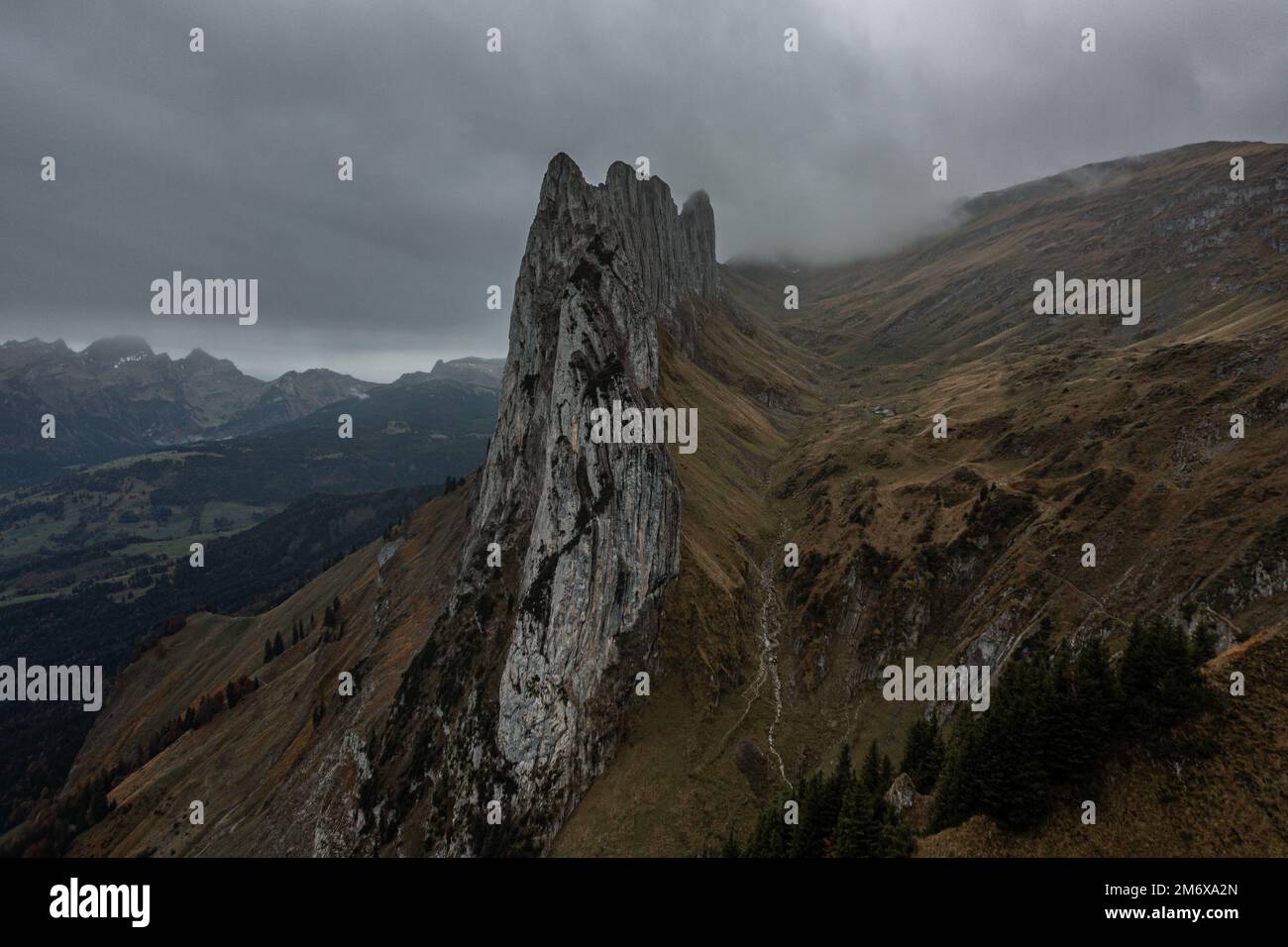 An aerial view of a mysterious rocky Alpstein peaks with overcast Stock ...