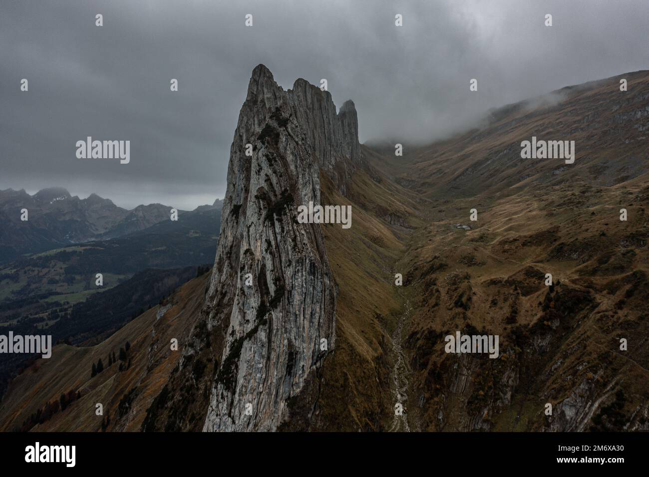 An aerial view of a mysterious rocky Alpstein peaks with overcast Stock ...