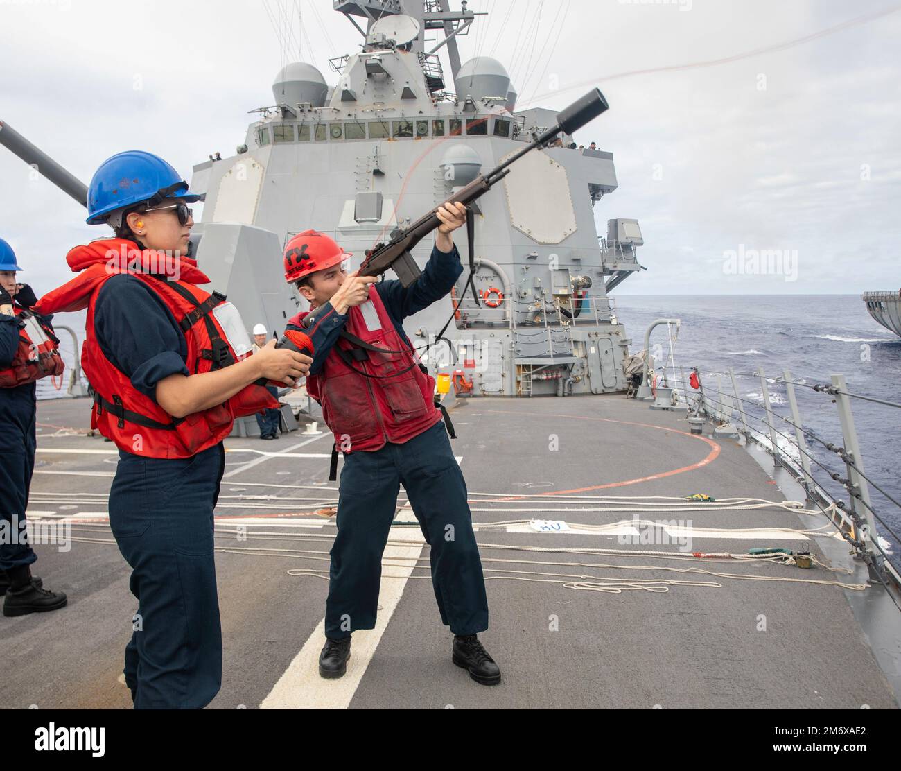 PHILIPPINE SEA (May 8, 2022) Gunner’s Mate 3rd Class Sam Wolff (right ...