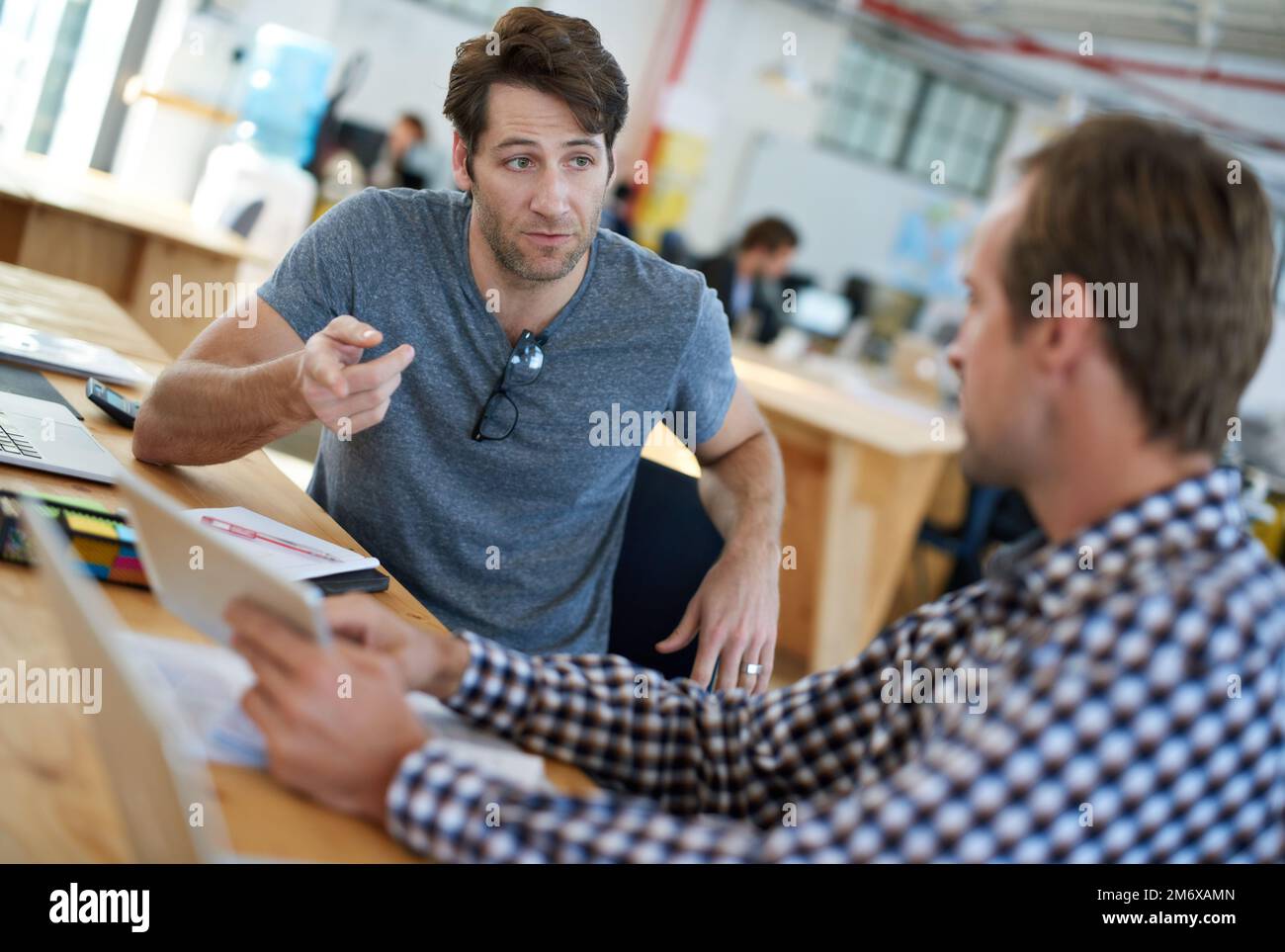 We make technology work for us. business colleagues discussing matters ...