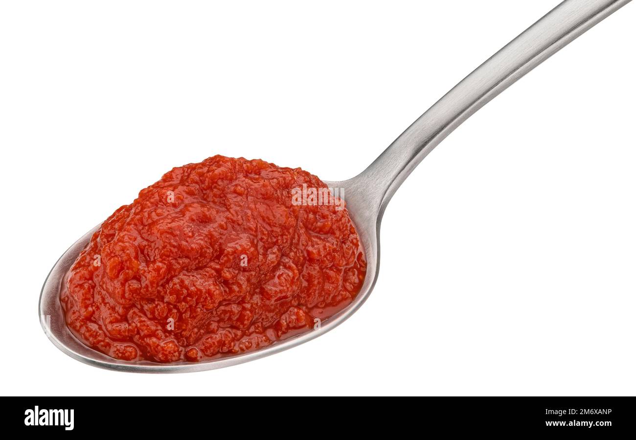 Tomato paste in spoon isolated on white background Stock Photo - Alamy