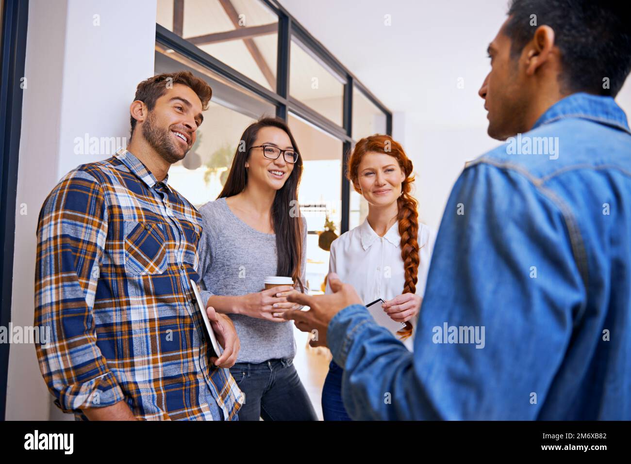 Explaining his ideas. a designer sharing his ideas with his colleagues ...