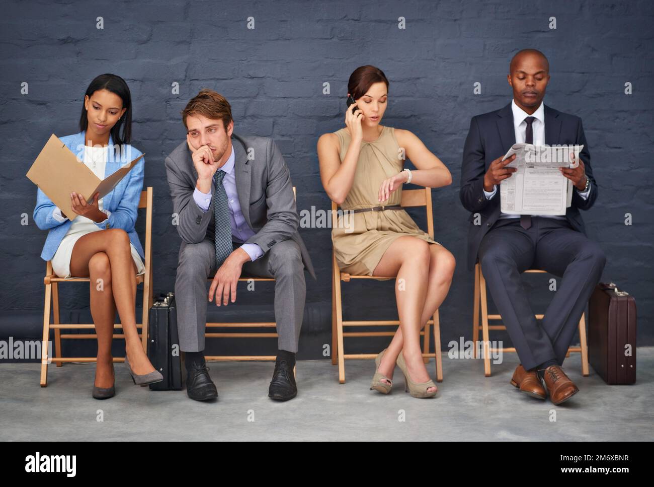 Separating the competition. Full length shot of four people sitting on ...