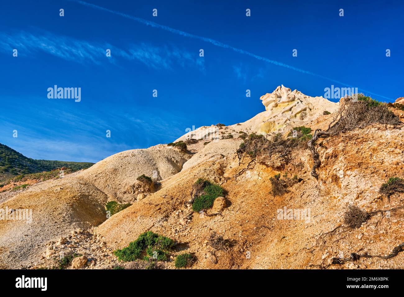 Natural rock formations of yellow cliffs on low sunlight, Milos, Greece ...