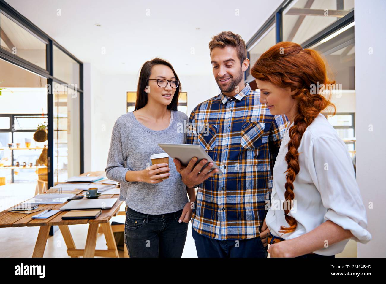 Team four women discussing design hi-res stock photography and images ...