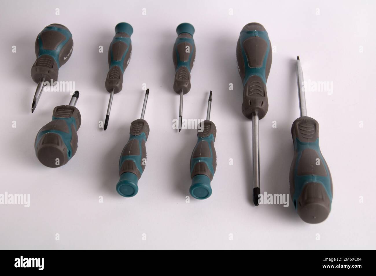 photo of a working screwdriver on a white background Stock Photo - Alamy