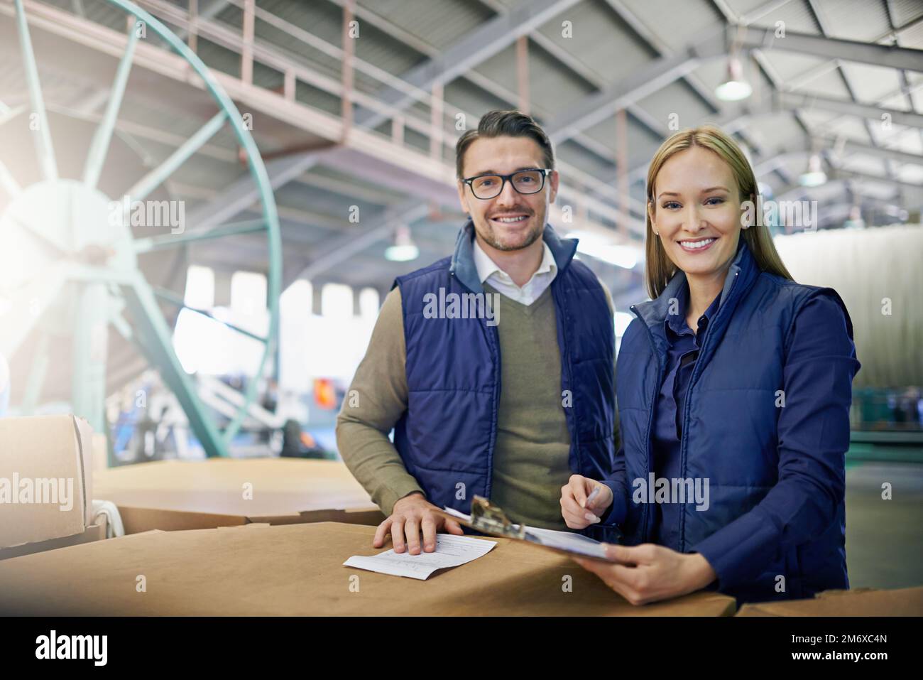 We make logistics look easy. Portrait of a two managers reading ...