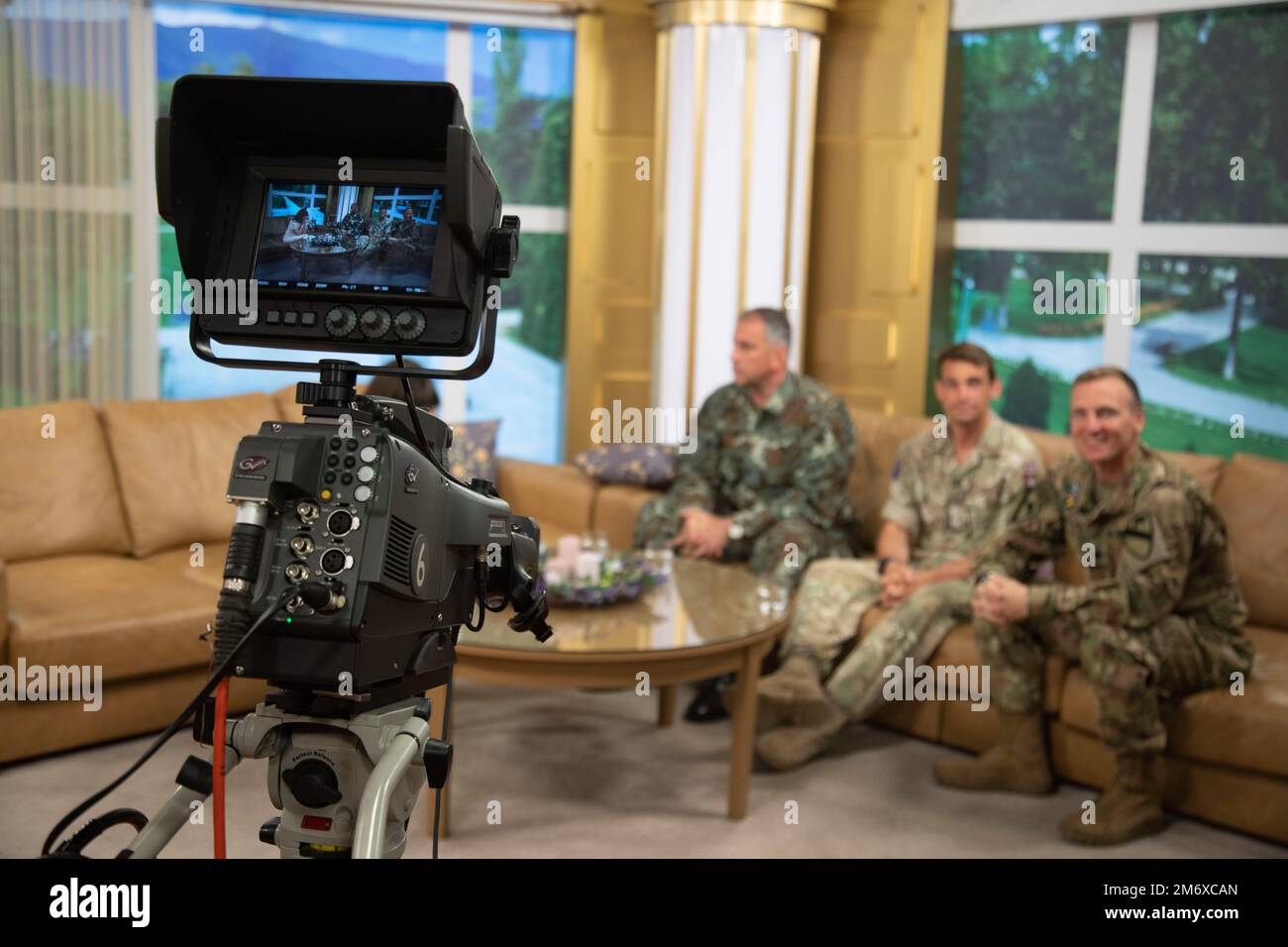 Ms. Elena Stojanovska prepares North Macedonian Army COL Vladimir Stojanovski, British Lt. Col ...