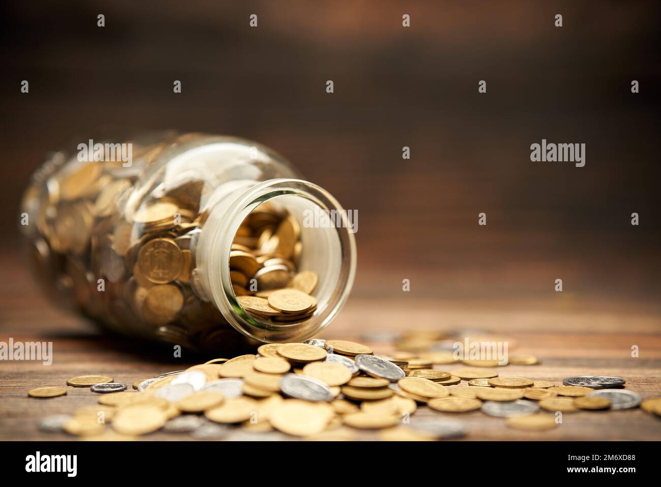 Glass jar filled gold coins hi-res stock photography and images - Alamy