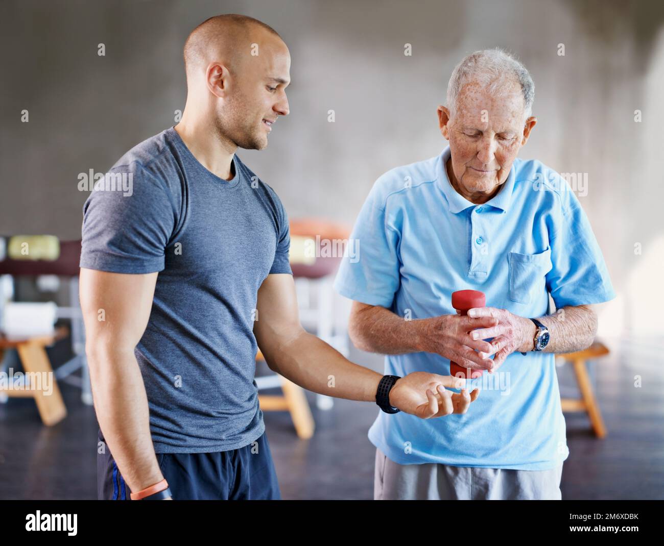 Small steps to a full recovery. a physiotherapist helping a senior man ...