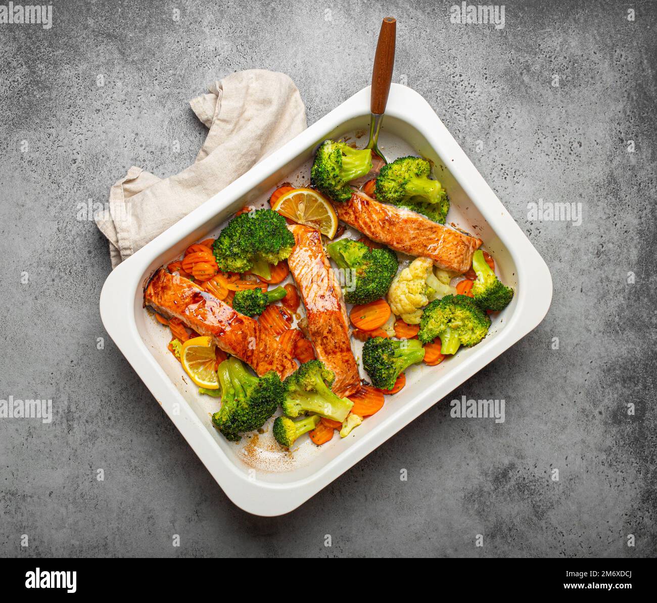 Top view of healthy baked fish salmon steaks, broccoli, cauliflower ...