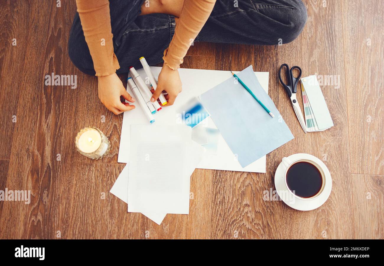 Young brunette african american woman creating her Feng Shui wish map ...