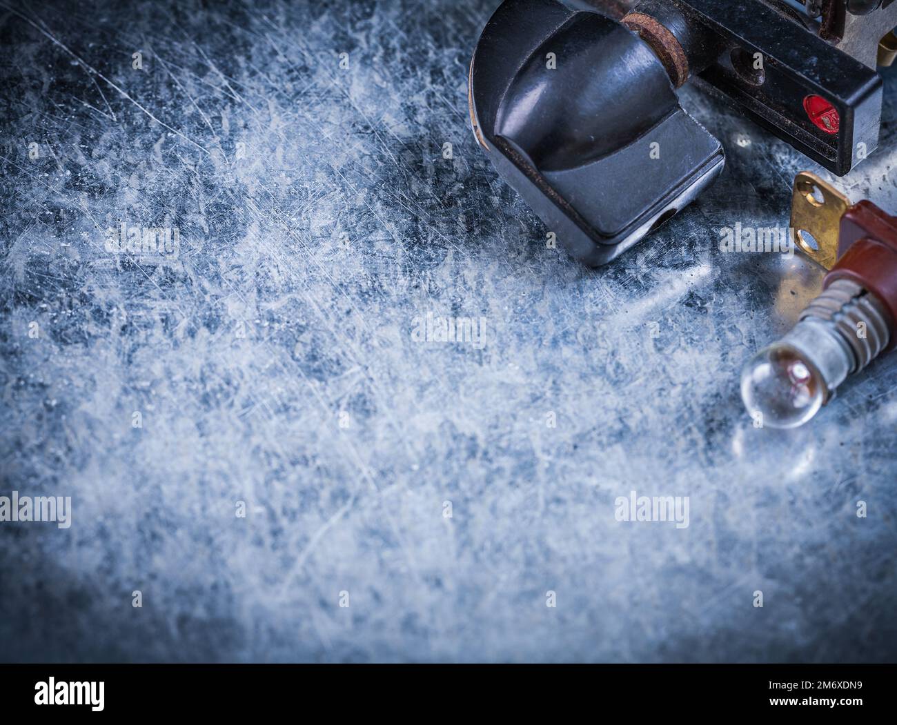 Electric resistor lamp on metallic surface vintage electricity concept ...