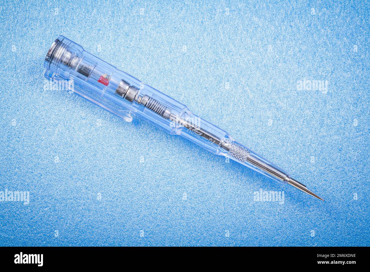 Electric tester on blue background horizontal view electricity concept ...