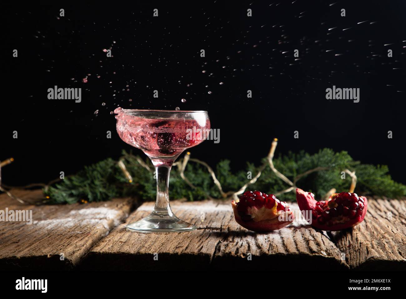 Splashing cocktail and fireworks for New Year Stock Photo - Alamy