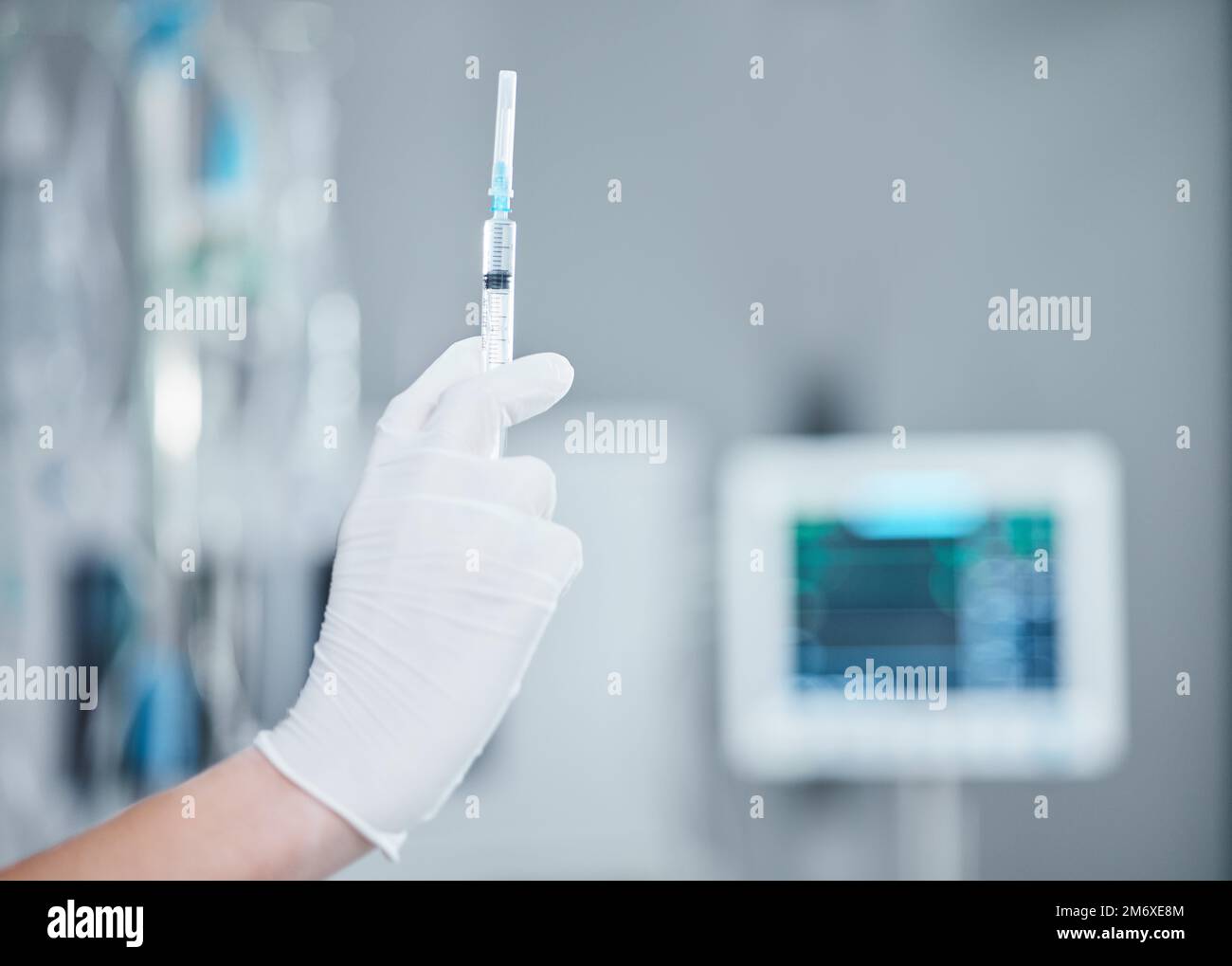 Hospital, healthcare and hand of doctor with syringe, needle or vaccine ...