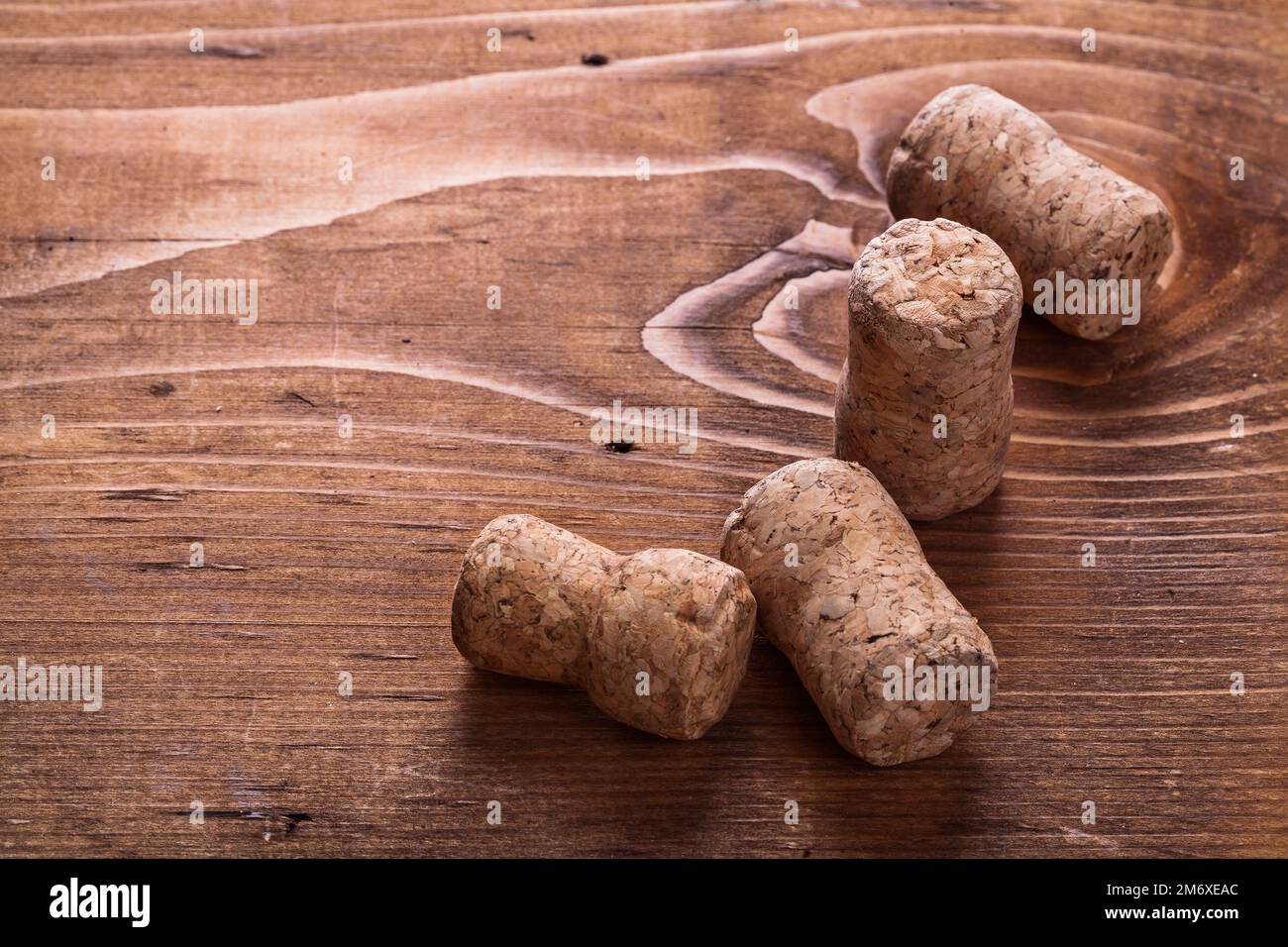 four cork of champagne on vintage wooden board alcohol concept Stock ...