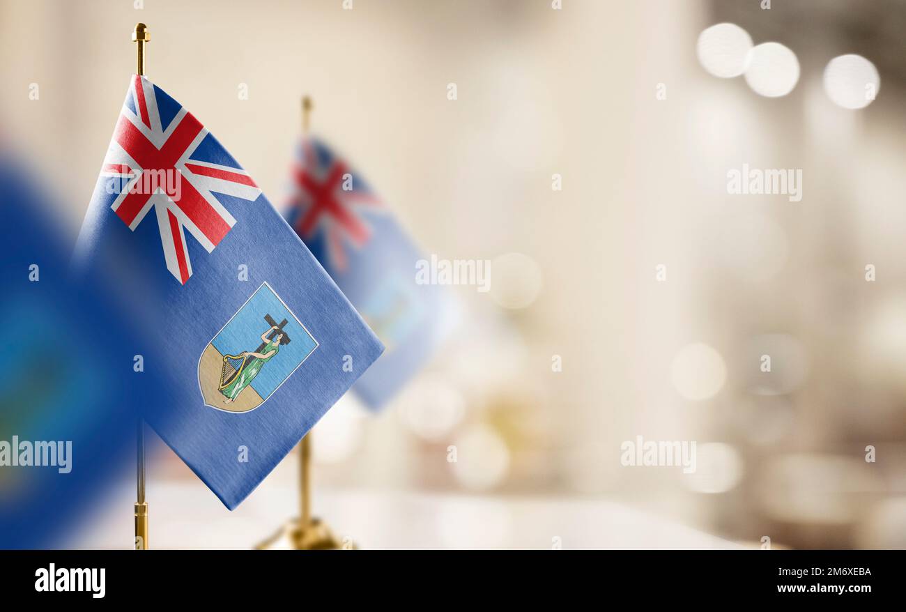Small flags of the Montserrat on an abstract blurry background Stock ...
