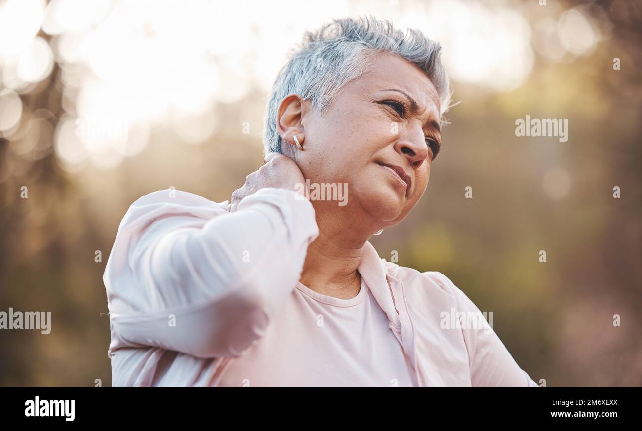 Exercise, neck pain and senior woman outdoor, fitness and injury while ...