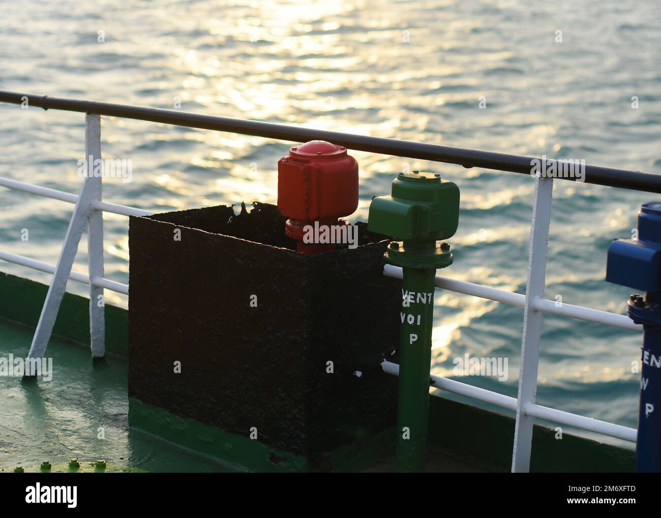 Valve from discharge pipe in a chemical tanker with morning sun Stock ...