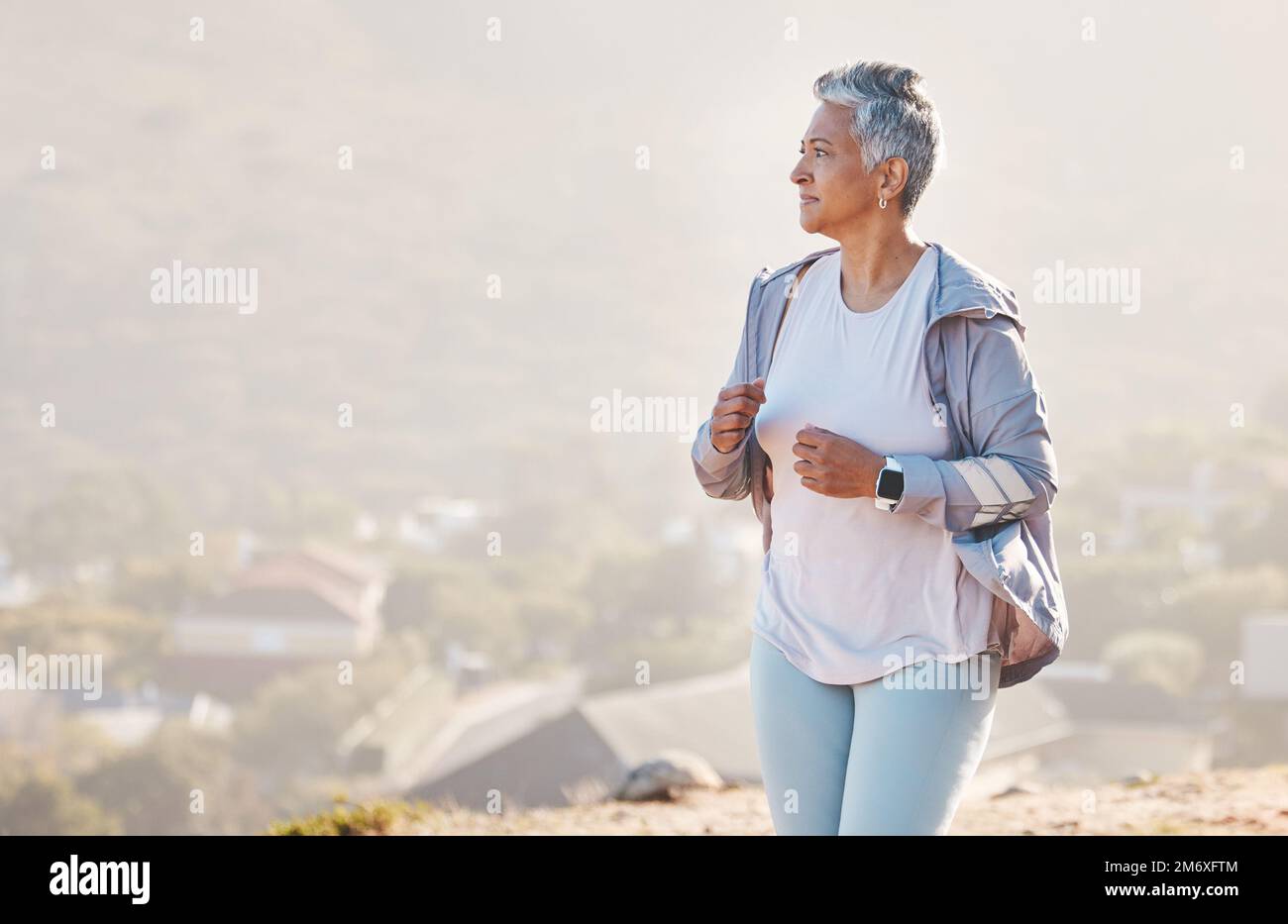 Running, mature woman and fitness on mountains, nature background and ...