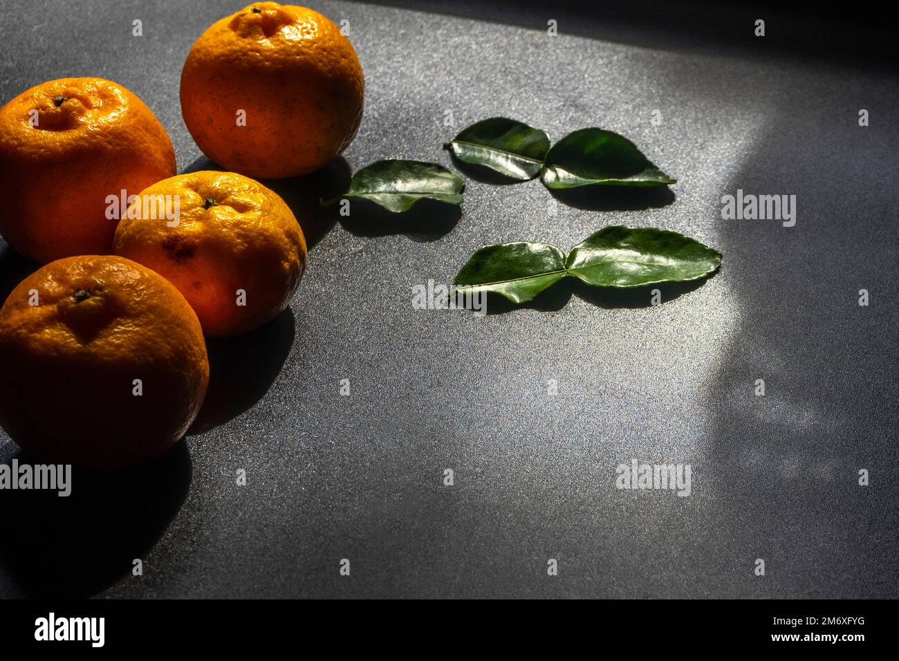 Orange fruits with light and shadow on white background Stock Photo - Alamy