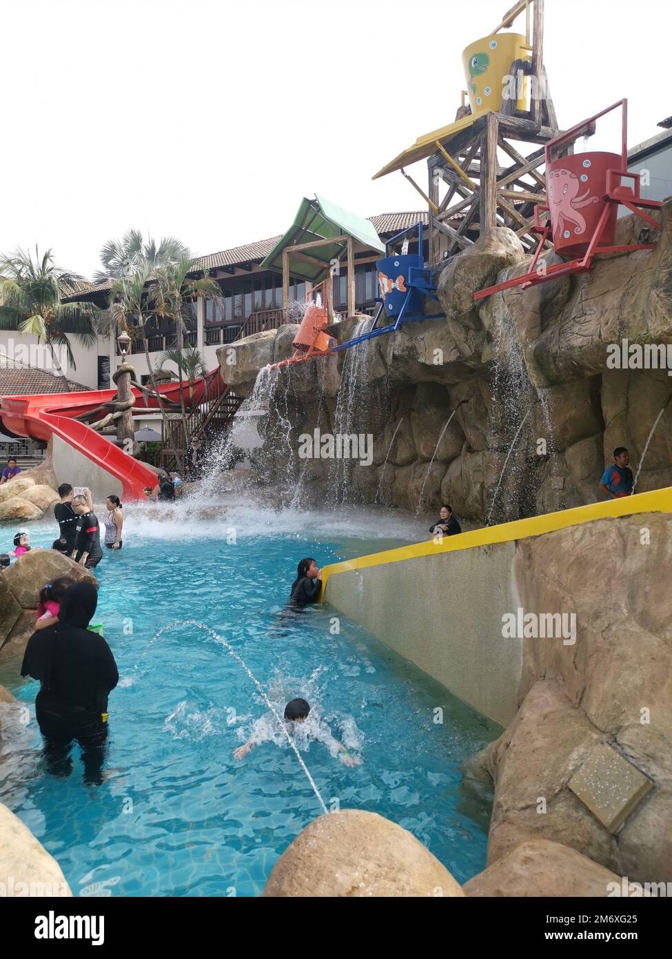 Perak, Malaysia. December 25,2022: Children and adult tourists enjoying ...