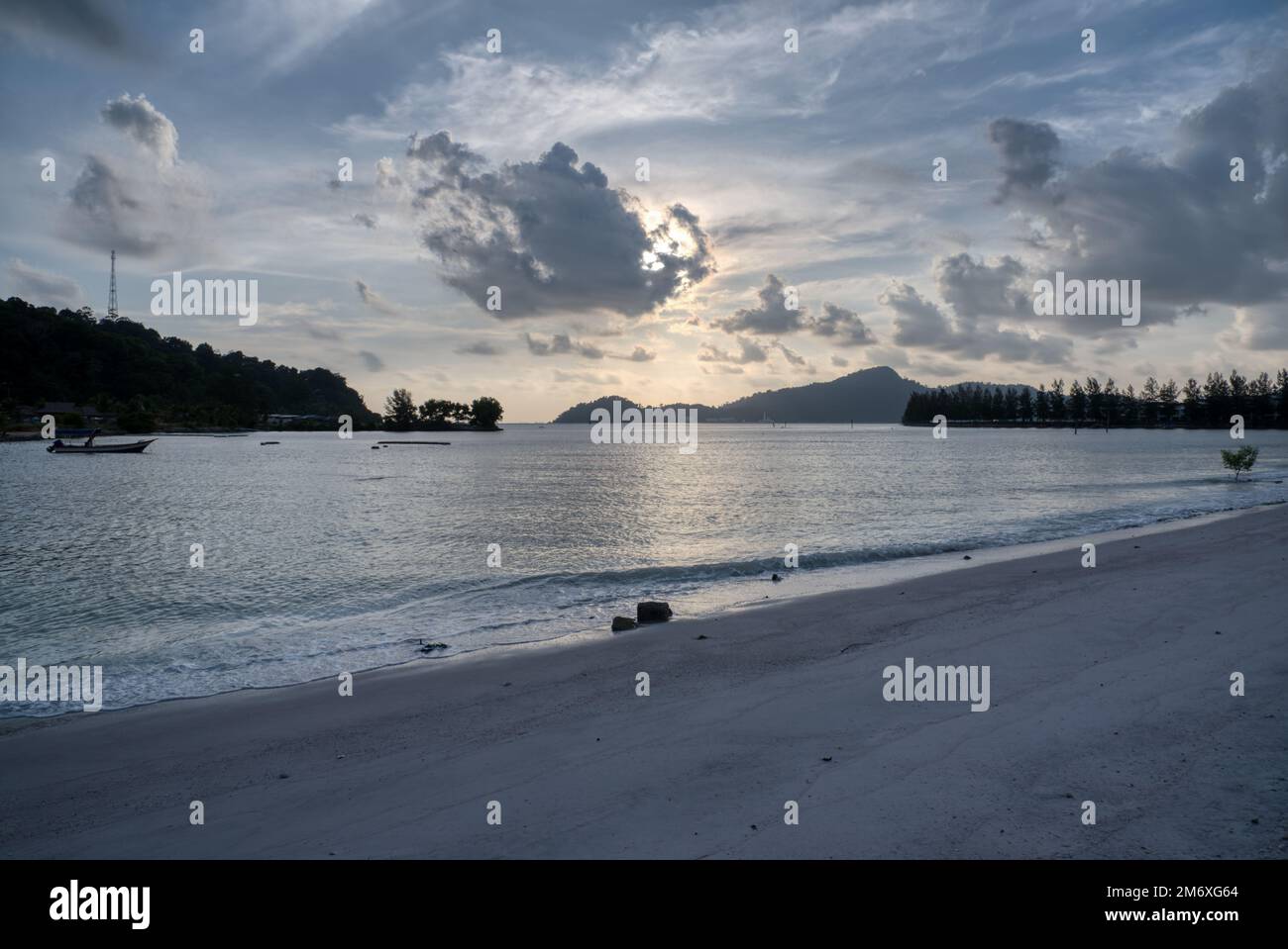 cloudy sunset at the quiet isolated fishing beach Stock Photo - Alamy