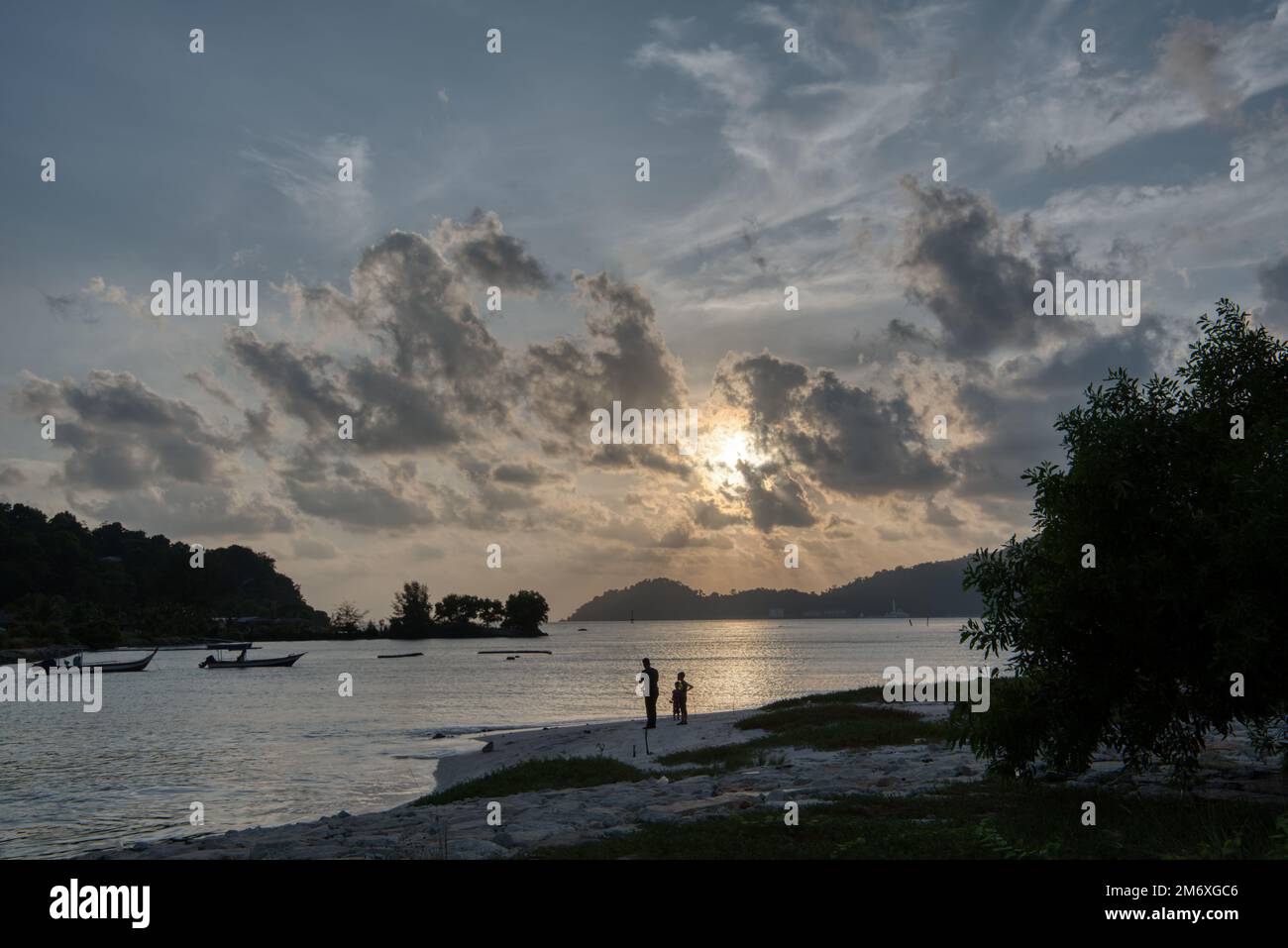 cloudy sunset at the quiet isolated fishing beach Stock Photo - Alamy