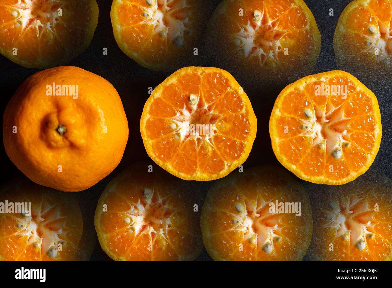 Fresh orange fruits with cloning effect as background, top view Stock ...