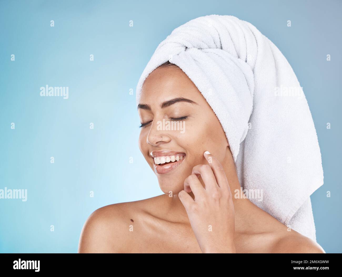 Woman, face and happy skincare with towel for luxury beauty, salon spa ...