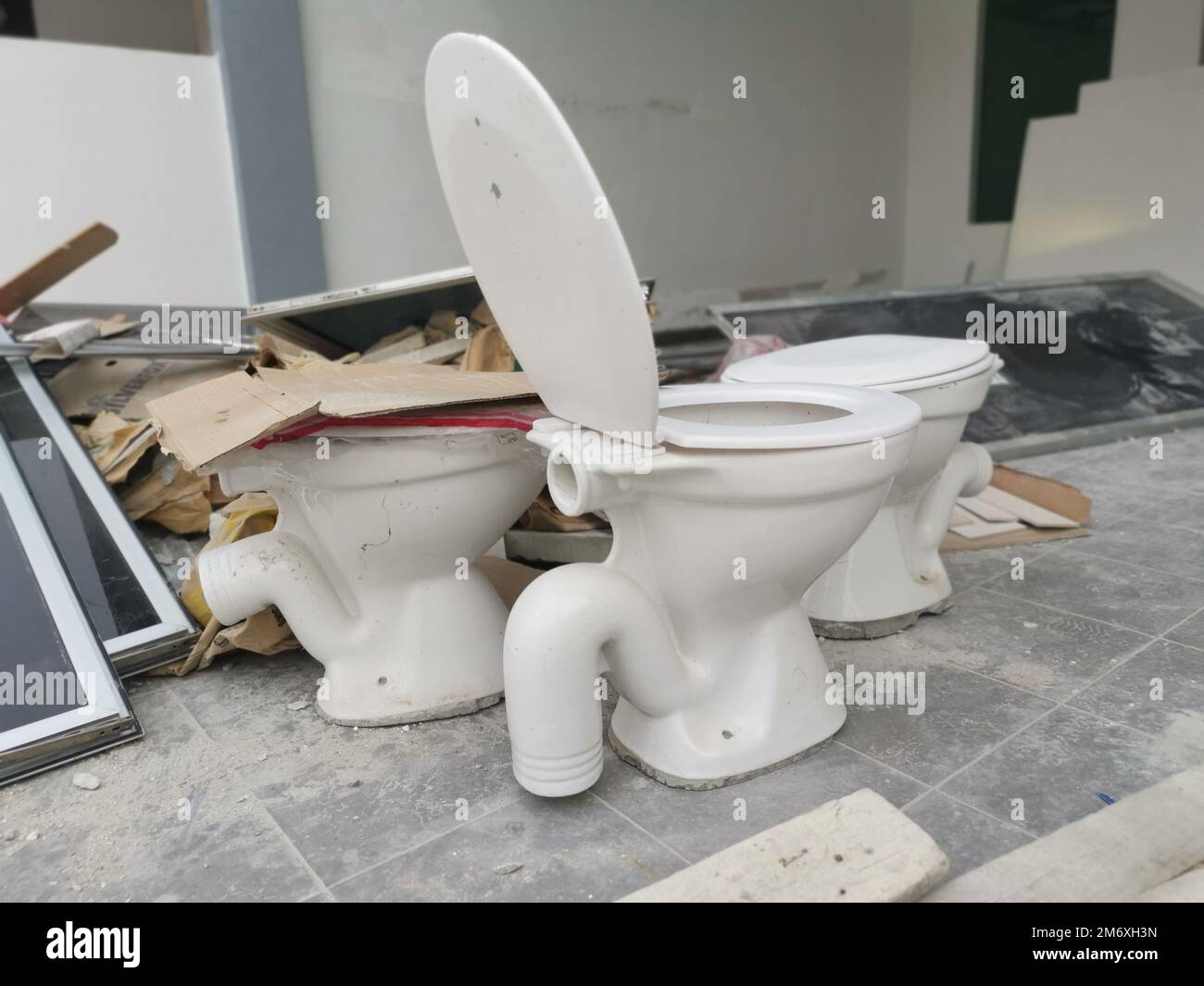 white ceramic toilet seat with slid Stock Photo - Alamy
