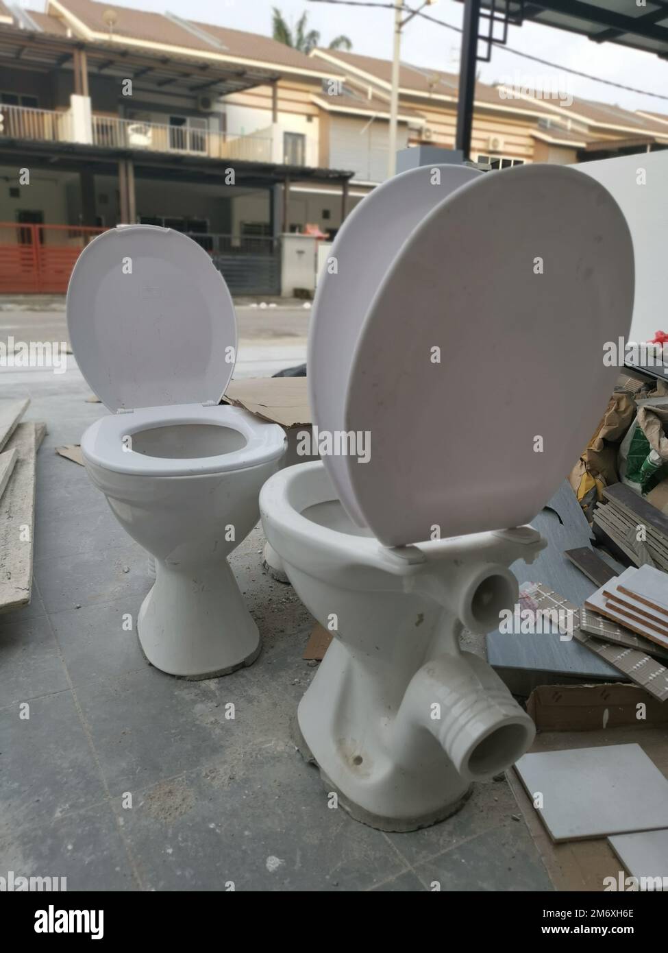 white ceramic toilet seat with slid Stock Photo - Alamy